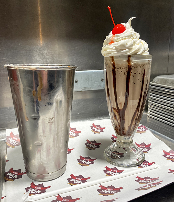 The milkshake that time forgot—complete with whipped cream mountain and cherry summit. Worth every brain-freeze moment.