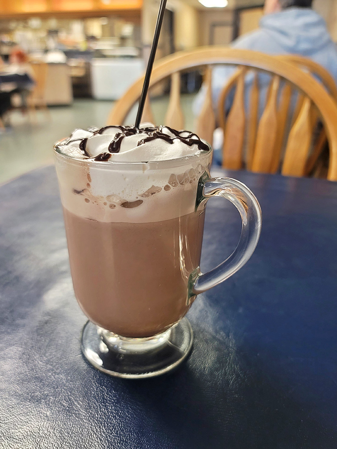 This isn't just hot chocolate with whipped cream—it's what clouds must taste like if they were made of chocolate and childhood memories.