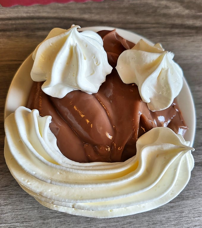 Chocolate pudding elevated to an art form with peaks of fresh whipped cream. Spoons have been known to fight over the last bite.
