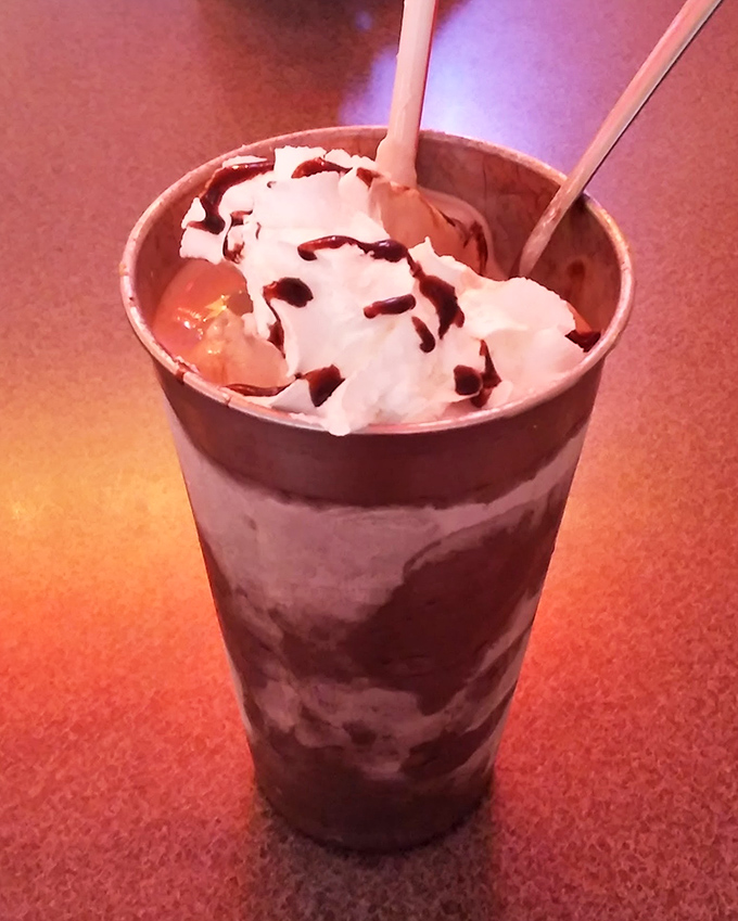 A chocolate milkshake so thick it laughs at your straw—part dessert, part beverage, all indulgence.