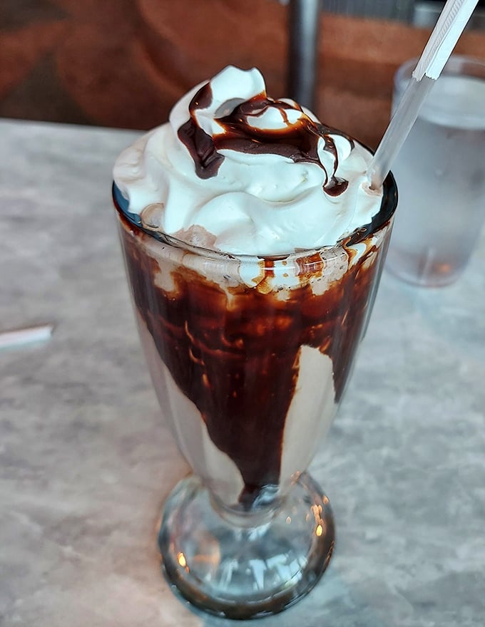 This chocolate milkshake isn't just a drink—it's a dessert, a work of art, and a childhood memory all swirled into one glorious glass.