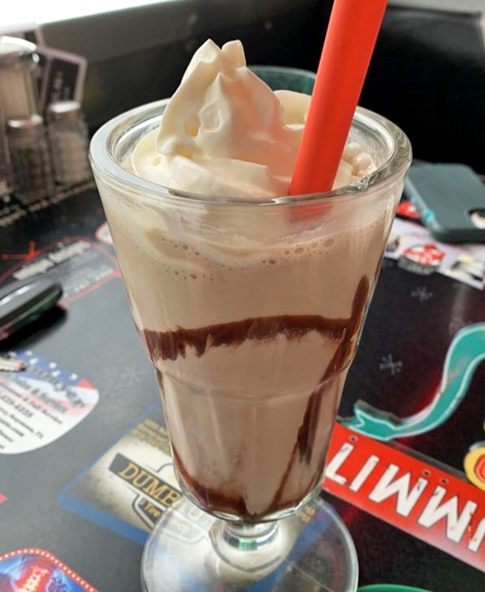 This isn't just a chocolate milkshake—it's a time machine in a glass, transporting you back to simpler days when happiness cost less than five dollars.