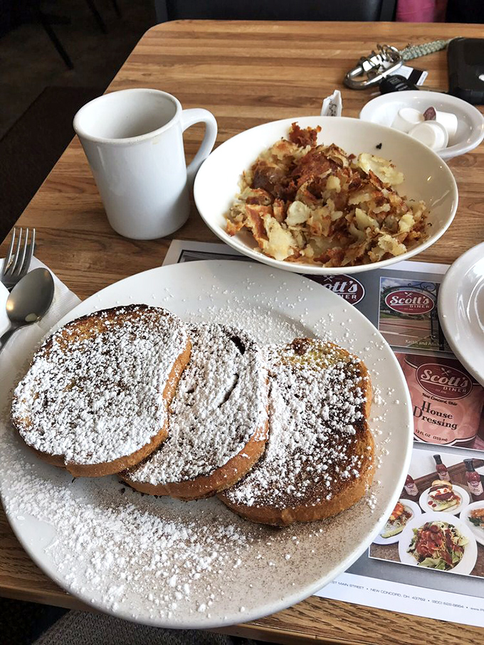 Cinnamon roll French toast that makes you question every breakfast decision you've ever made, paired with home fries that refuse to be overshadowed.
