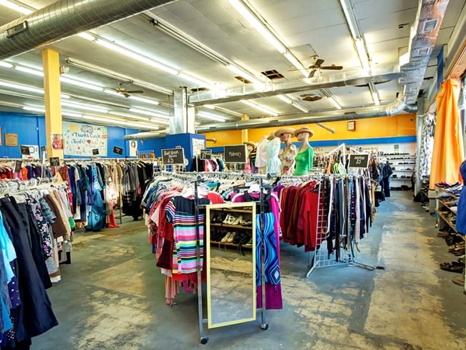 Color-coded clothing racks create a rainbow of possibilities, where yesterday's fashion choices become tomorrow's vintage statement pieces.