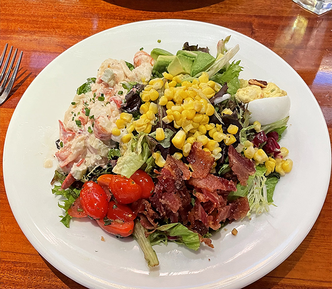 A salad that's having an identity crisis as a feast—loaded with enough goodies to make you forget you ordered something "healthy."