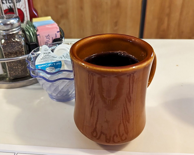 The humble brown coffee mug – civilization's greatest achievement and the unsung hero of every great diner experience across America.