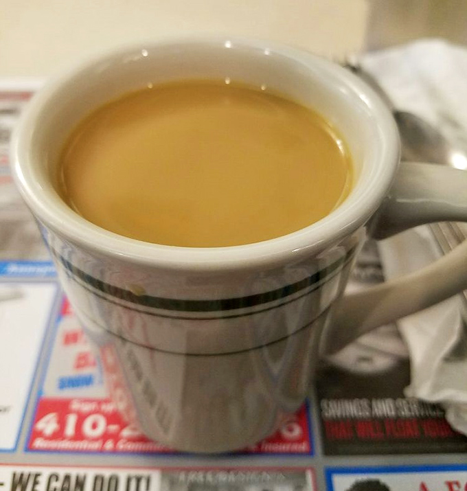 The humble diner coffee cup—holding the elixir that transforms morning zombies into functioning humans. Simple, strong, and surprisingly profound.