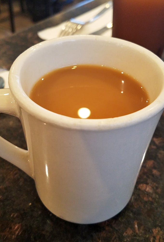 The humble white mug containing liquid ambition. In a world of fancy coffee contraptions, sometimes all you need is a bottomless cup of diner brew.