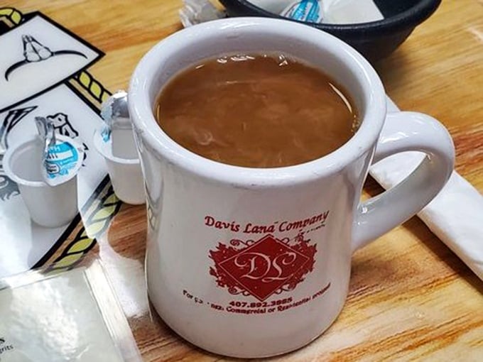 Diner coffee in a sturdy mug – not fancy, not pretentious, just honest brew that keeps coming until you surrender.