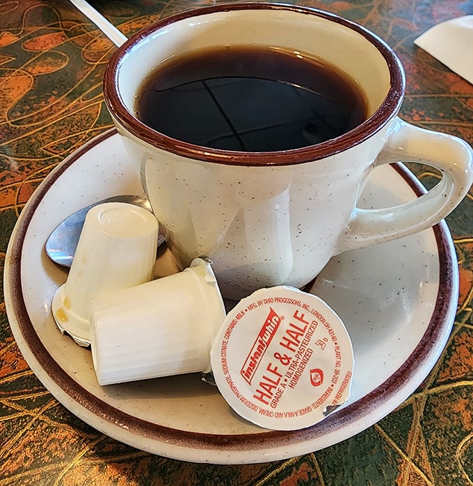 That classic diner coffee—strong enough to wake you up but smooth enough to keep you coming back. The ceramic mug keeps it hot through endless refills.