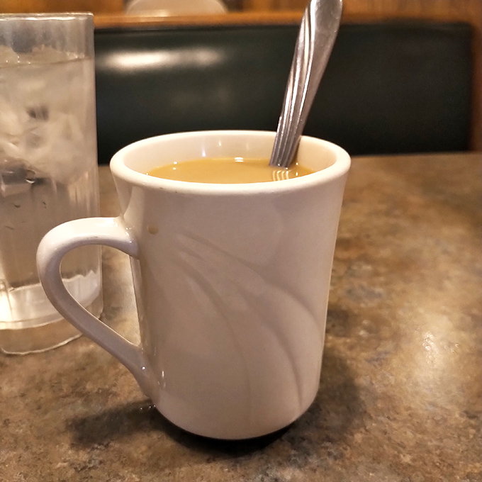 Coffee in a classic white mug—the unsung hero of every great diner experience. Simple, honest, and exactly what you need after that second slice of pie.