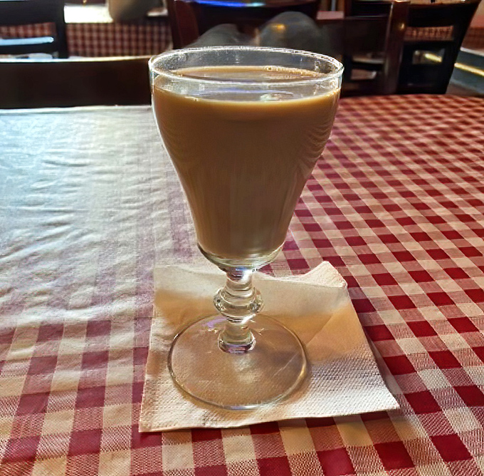 Coffee served in a proper glass, on a proper tablecloth – a civilized moment in an increasingly uncivilized world.
