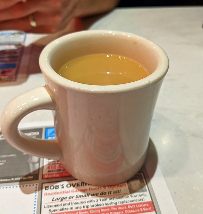 The humble diner coffee mug—holding the elixir that transforms morning zombies into functioning humans since time immemorial.