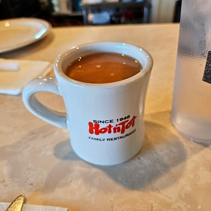 The official Hot N Tot mug—holding what might be the most honest cup of coffee in Los Angeles County.
