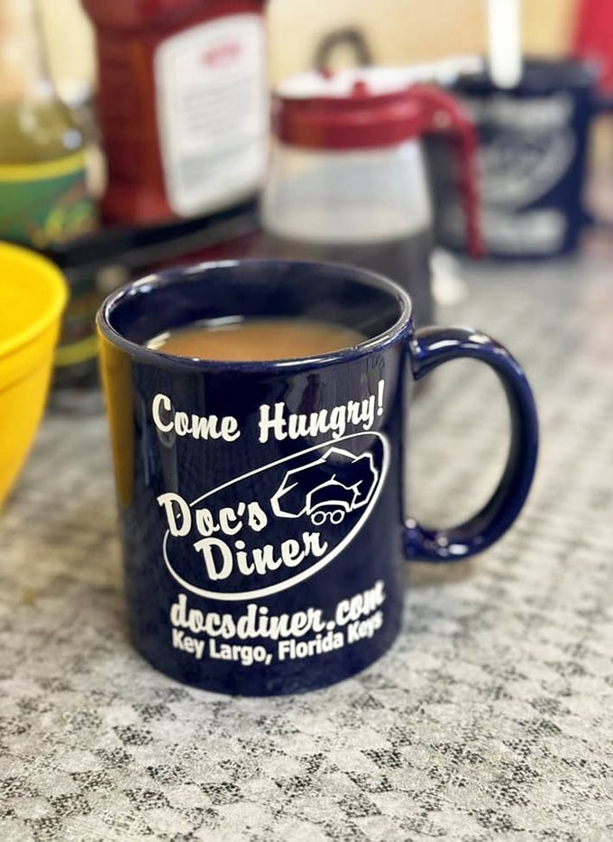 "Come Hungry!" isn't just a slogan on this navy blue mug – it's the best advice you'll get all day in Key Largo.