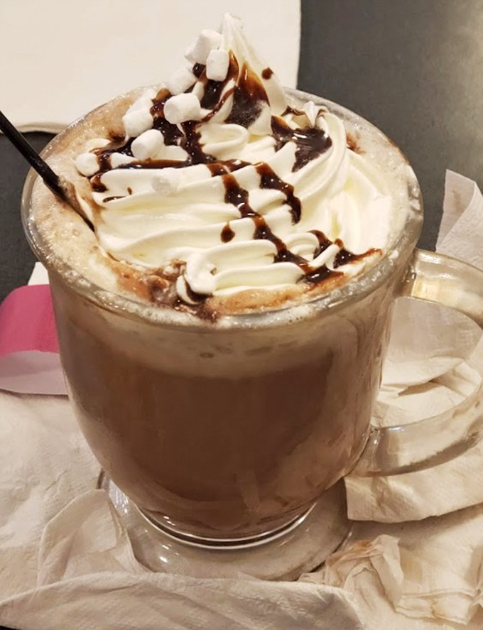 Coffee elevated to dessert status! This whipped cream mountain topped with chocolate drizzle transforms caffeine into a celebration.