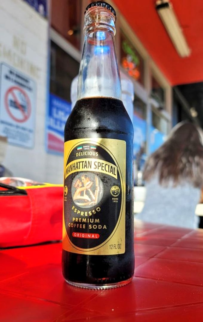 Manhattan Special coffee soda—the authentic New York beverage experience. Like liquid tiramisu in a bottle, it's the perfect pizza companion.