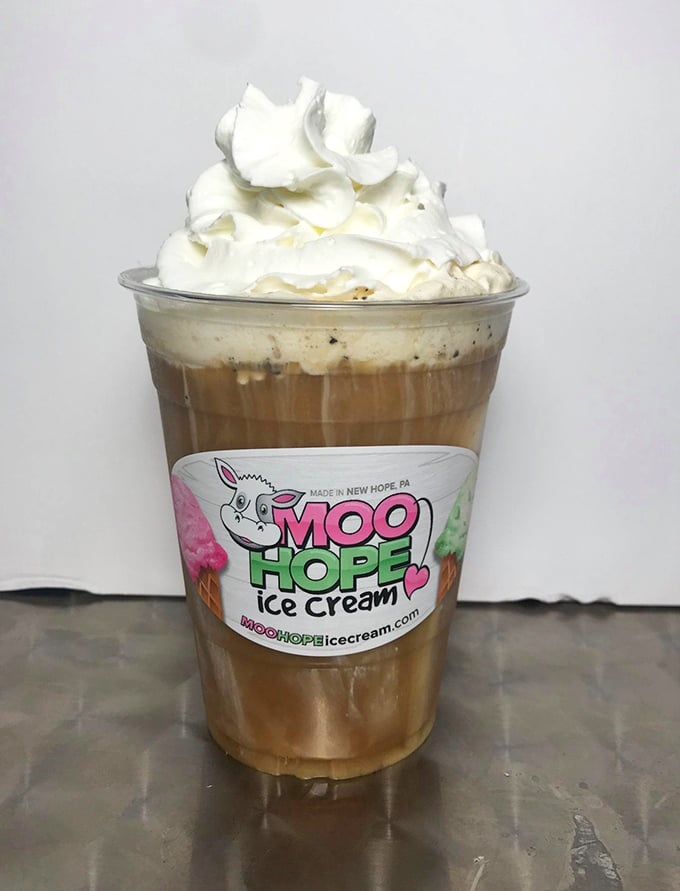 This coffee creation topped with a cloud of whipped cream isn't just a drink—it's morning and dessert having a delicious identity crisis.