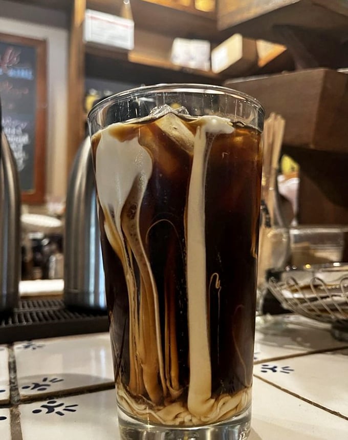 Coffee and cream performing their morning ballet in a glass—the kind of simple pleasure that makes Monday feel like Saturday.