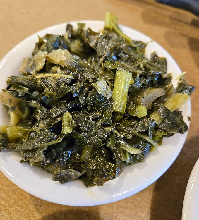 These collard greens have clearly been simmering with purpose—tender, seasoned, and ready to make any meat dish feel right at home.