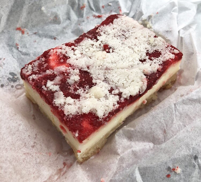This cream cheese cherry bar doesn't just satisfy a sweet tooth – it creates a cult following. The crumb topping is practically a religious experience.