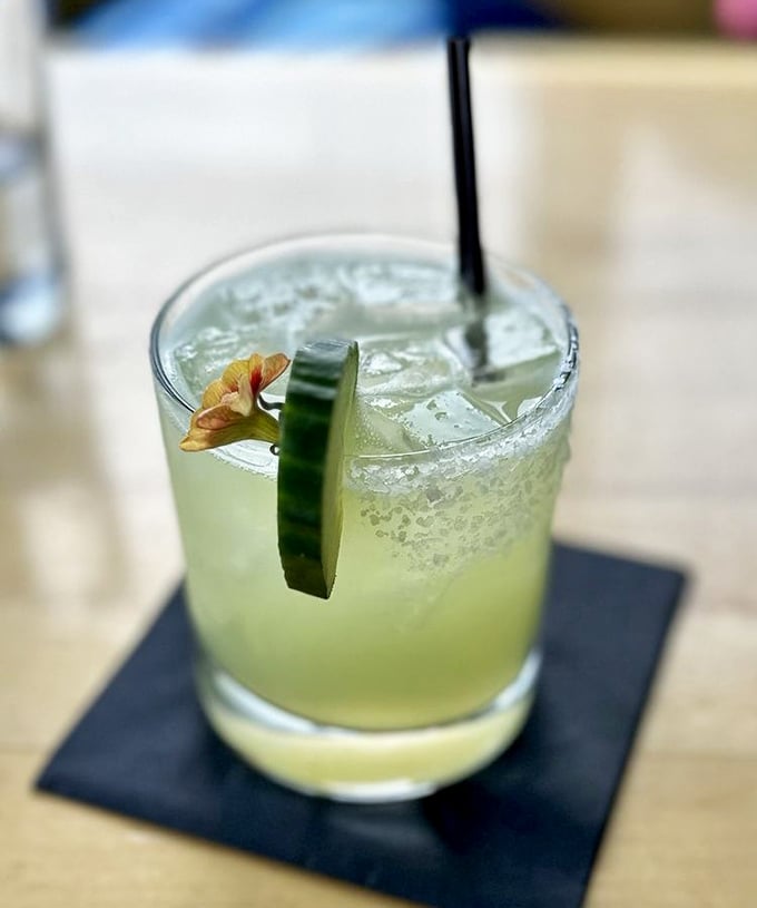This cucumber basil margarita isn't just a drink—it's a vacation in a glass. The salt rim is your passport to relaxation.
