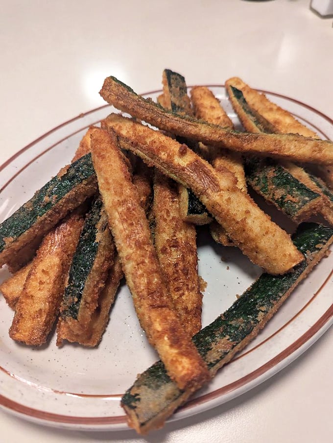 Fried zucchini sticks—the vegetable that finally found its true calling. Crispy, golden, and utterly irresistible with ranch dressing.
