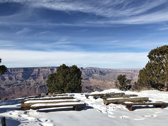 Winter transforms the viewing area into nature's VIP lounge, where snow provides front-row seats to geological magnificence.