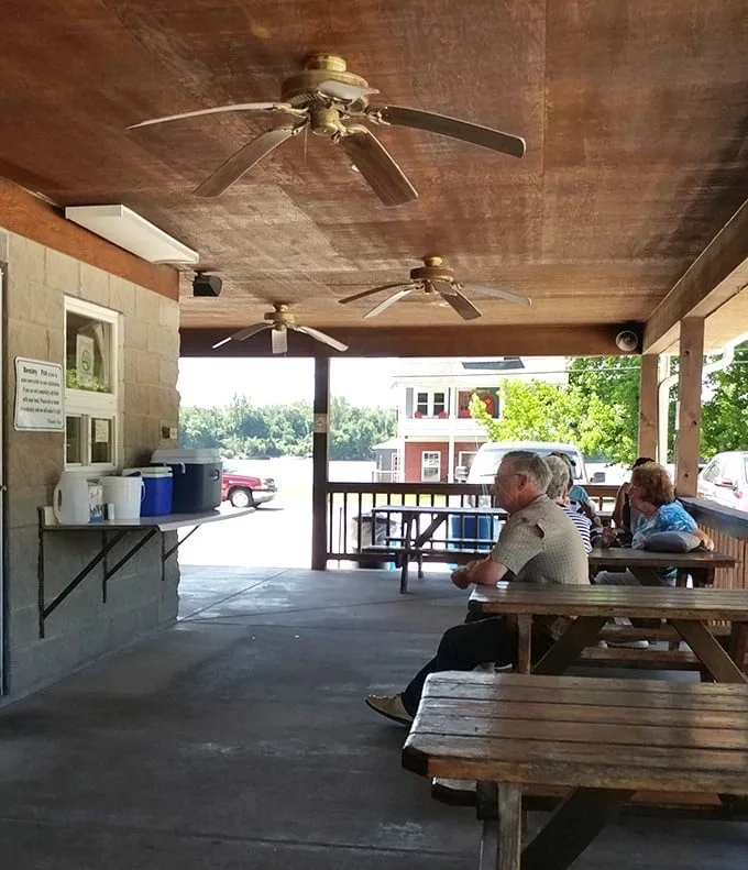 The covered porch – where strangers become friends over shared tables and the universal language of "mmm, try this."