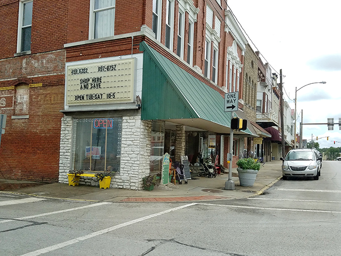 Stroll down these historic sidewalks and you'll find treasures like this vintage storefront, where "Shop Here and Save" isn't just a slogan—it's a promise.