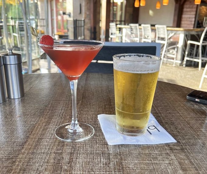 Liquid courage comes in many forms—here, a ruby-red martini flirts with a golden beer, like the odd couple of beverages that somehow work perfectly together.