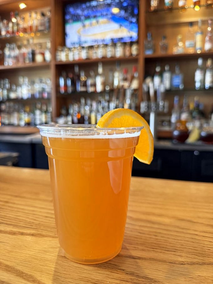 Sweet tea with an orange slice—the unofficial champagne of the South, served in a plastic cup that somehow makes it taste even more authentic.