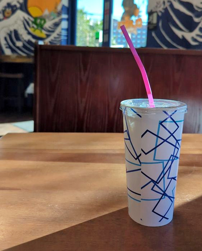 Even the drinks come with artistic flair. That straw isn't just a straw—it's your personal pipeline to refreshment between sandwich bites.