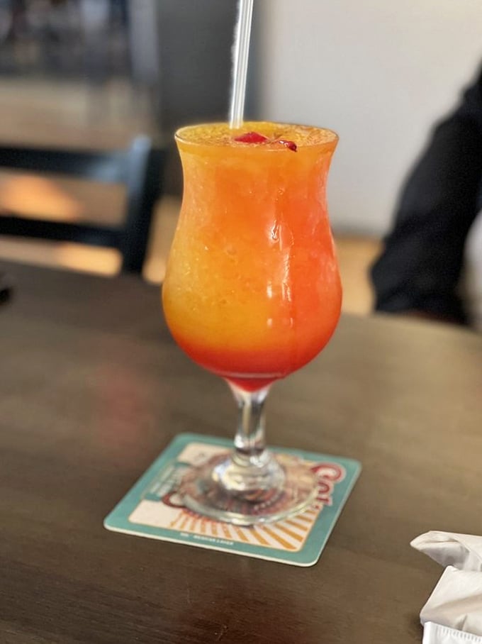 This sunset-in-a-glass cocktail isn't just a drink—it's vacation therapy. One sip and you're mentally booking a cabana somewhere tropical.