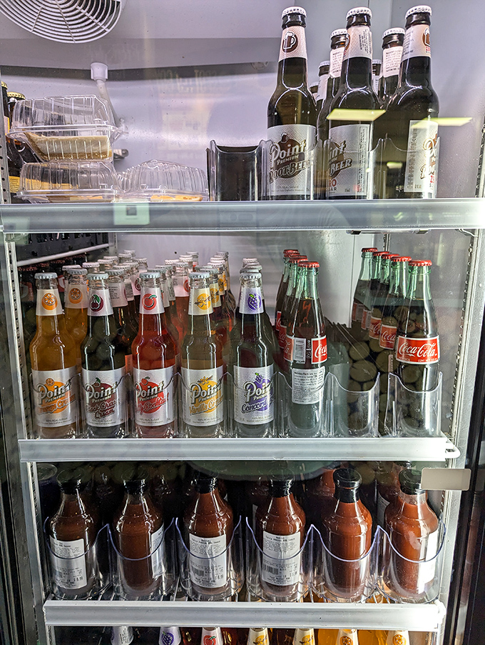 The beverage cooler offers Wisconsin's own Point Beer alongside the usual suspects – because good BBQ deserves proper hydration options.
