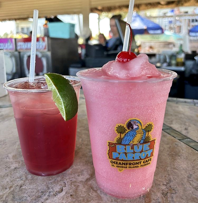 Frozen cocktails that taste like vacation decisions at their finest—the pink one practically screaming "you're not checking email today."