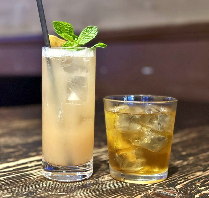 Cocktails and barbecue—a pairing as perfect as Astaire and Rogers. That mint garnish isn't just pretty; it's working overtime to refresh between bites.