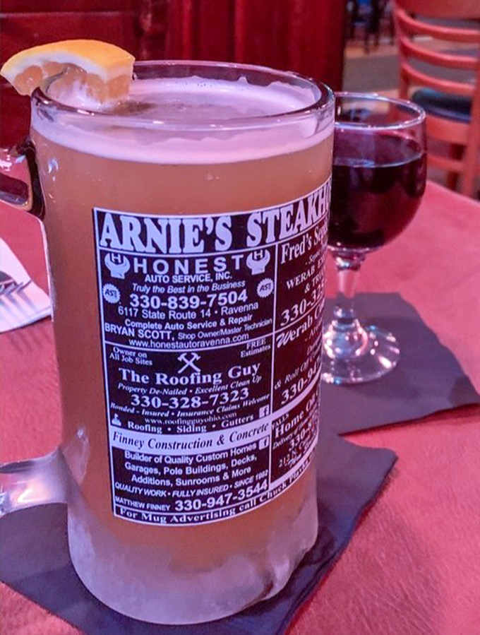 Even the beer mugs tell stories here—local ads on frosted glass remind you that you're drinking in a place where community matters.