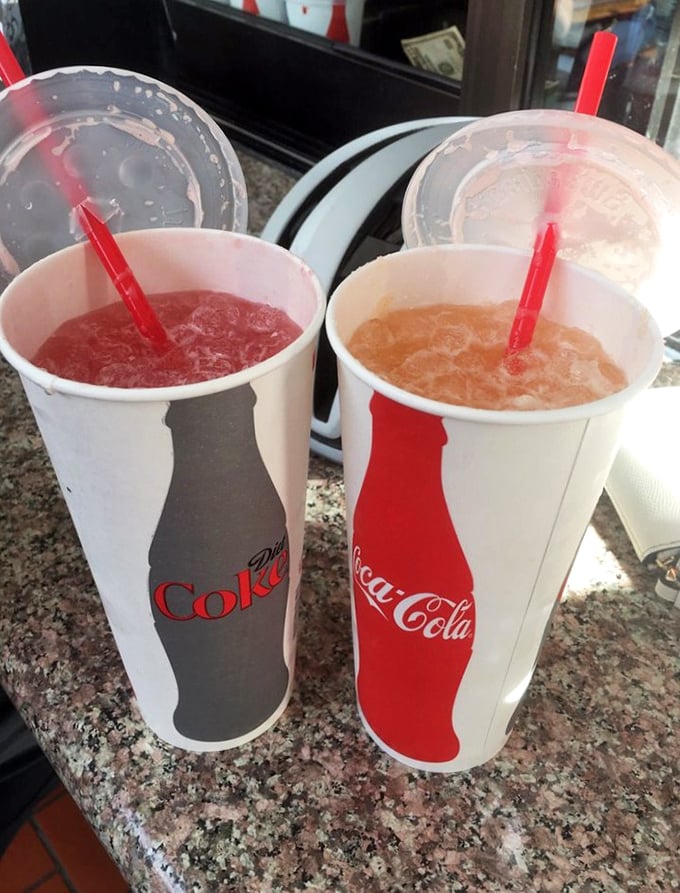 House-made aguas frescas in vibrant colors provide the perfect cooling complement to spicy flavors.