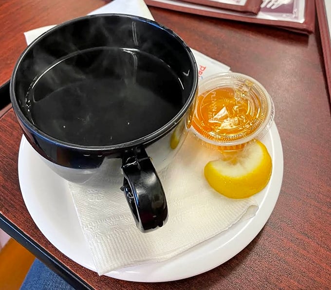 Coffee served with a slice of lemon—a European touch that says, "We care about the little details that elevate your morning."