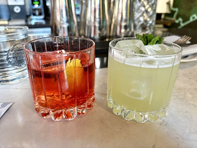 Cocktails that complement rather than compete with the food. That Negroni's ruby glow promises bitter-sweet perfection while its neighbor offers citrusy refreshment.