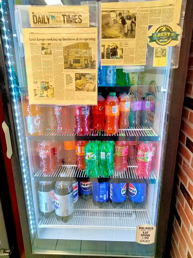 The beverage cooler – where colorful sodas stand ready to battle the salt and spice of your sandwich selection.