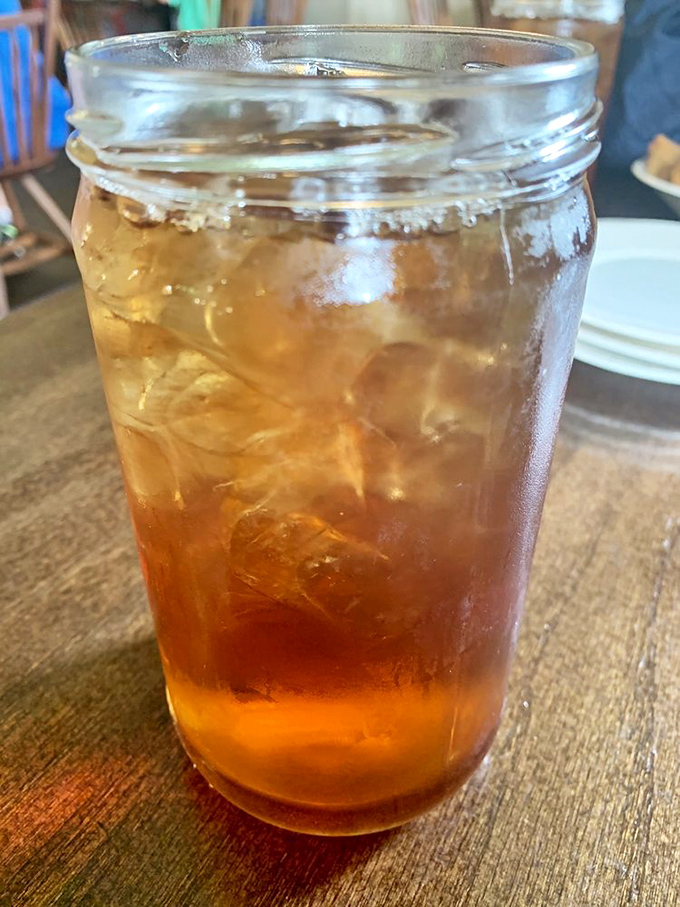 Sweet tea served in a mason jar—because some Southern traditions are too perfect to mess with. Liquid sunshine with ice.