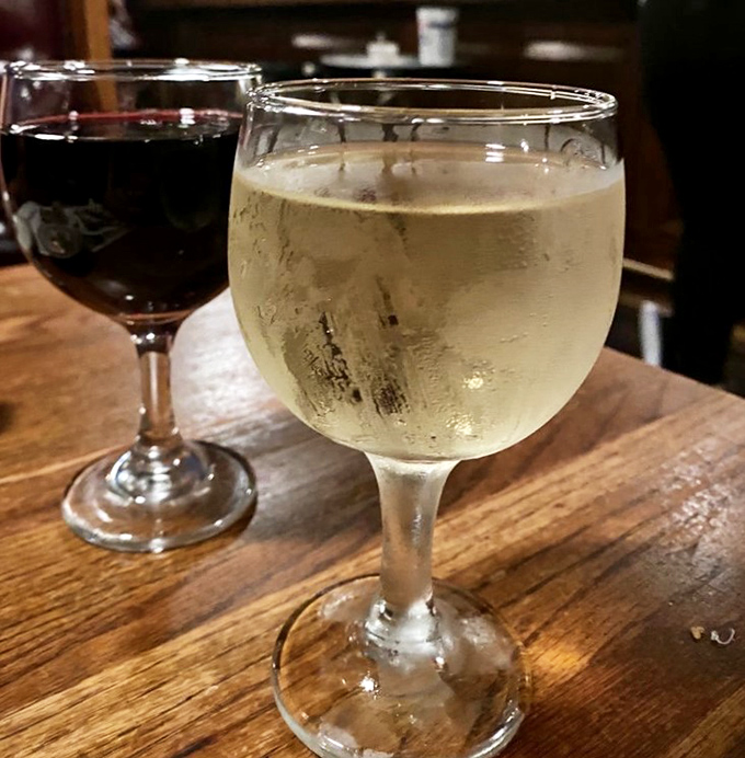 Wine glasses catching the light, promising that good times are just a sip away.