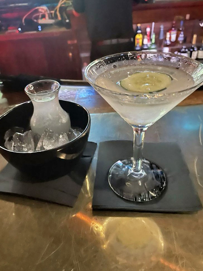 A properly made martini—cold, strong, and generous—served with enough extra in the shaker for that perfect top-off.