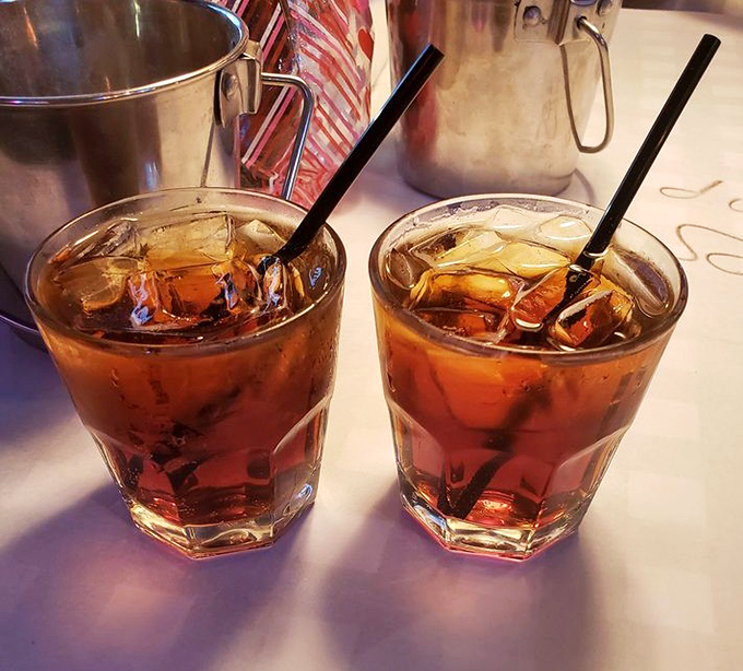Two glasses of sweet tea so perfectly amber they could be mistaken for liquid topaz—the unofficial state beverage of Florida, served properly iced and ready for sipping.