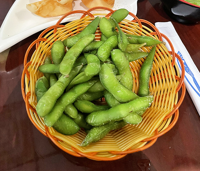 Edamame: nature's perfect snack food. These little green pods of joy are the potato chips of the sushi world – utterly addictive.