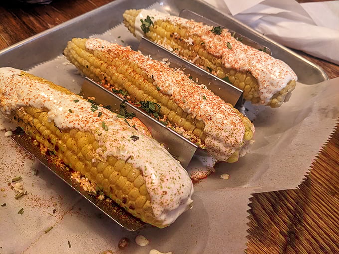Street corn elevated to art form—slathered with creamy sauce and dusted with spices that would make both Texas and Tennessee proud.