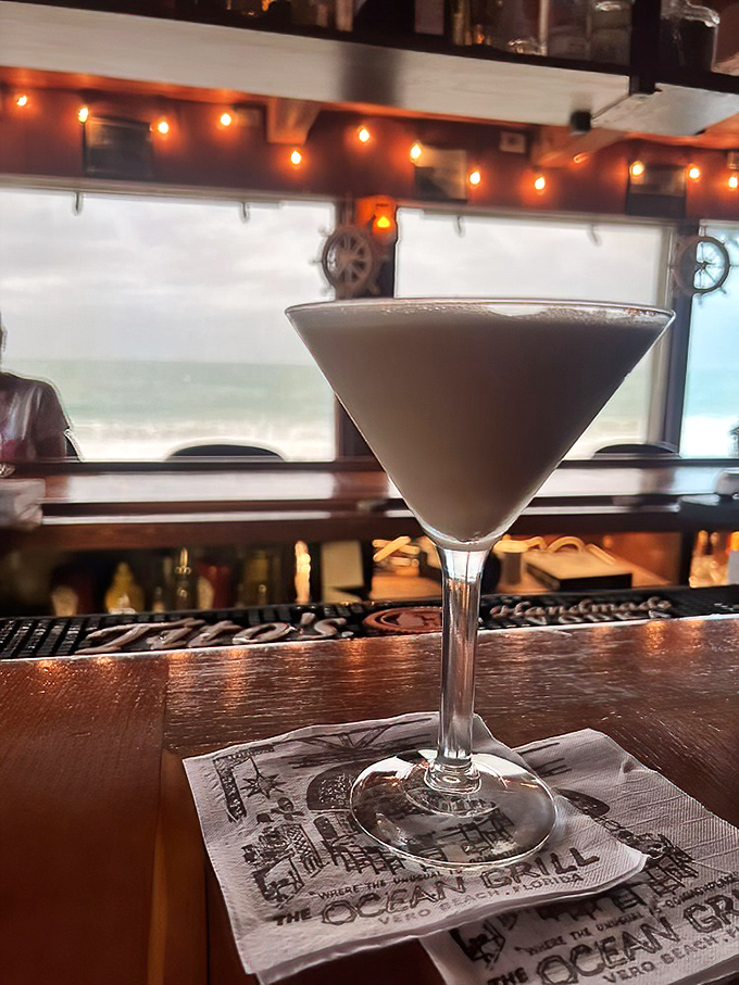 An espresso martini with the ocean as backdrop – because caffeine and alcohol with a view is basically vacation in a glass.