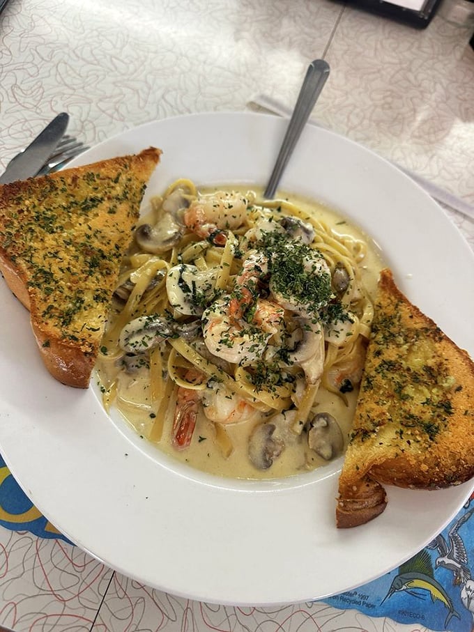 Pasta that proves diners can do Italian with flair. Those shrimp aren't just swimming in sauce—they're doing the backstroke in creamy heaven.